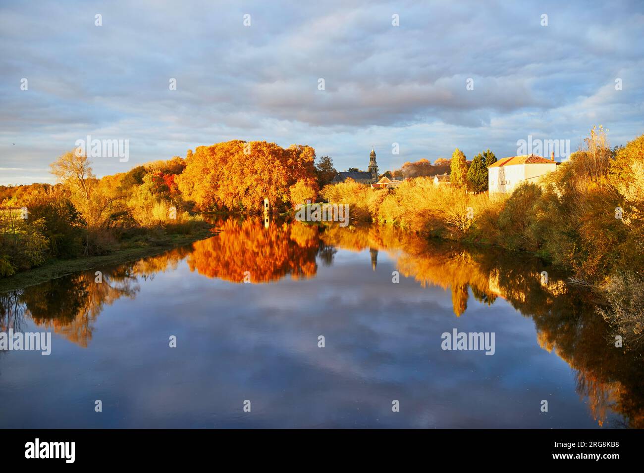 Scenic view of autumn forest and river Vienne near medieval castle of Les Ormes, France Stock ...