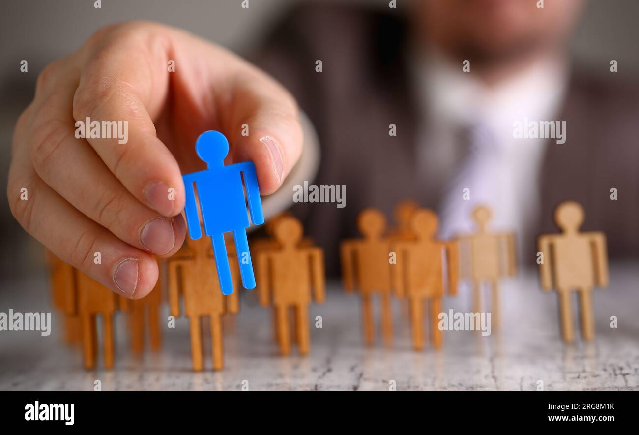 Man arm in suit take little plastic toy figure Stock Photo - Alamy