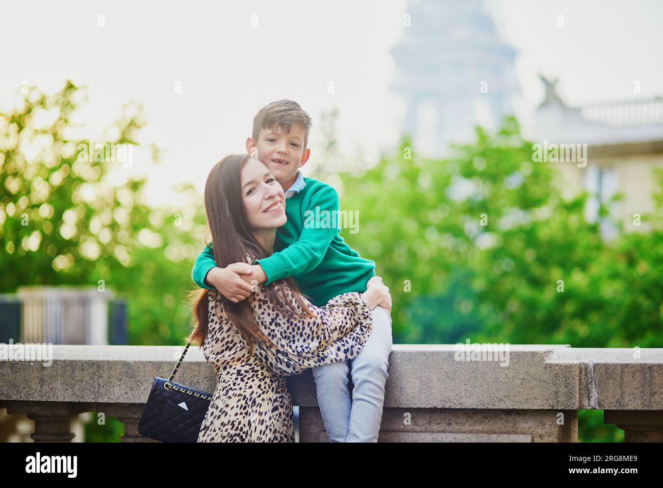 Happy family of two enjoying their trip to Paris, France. Mother and ...