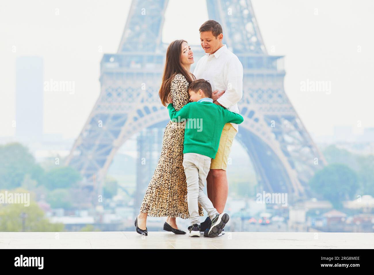 Happy family of three enjoying their trip to Paris, France. Mother ...