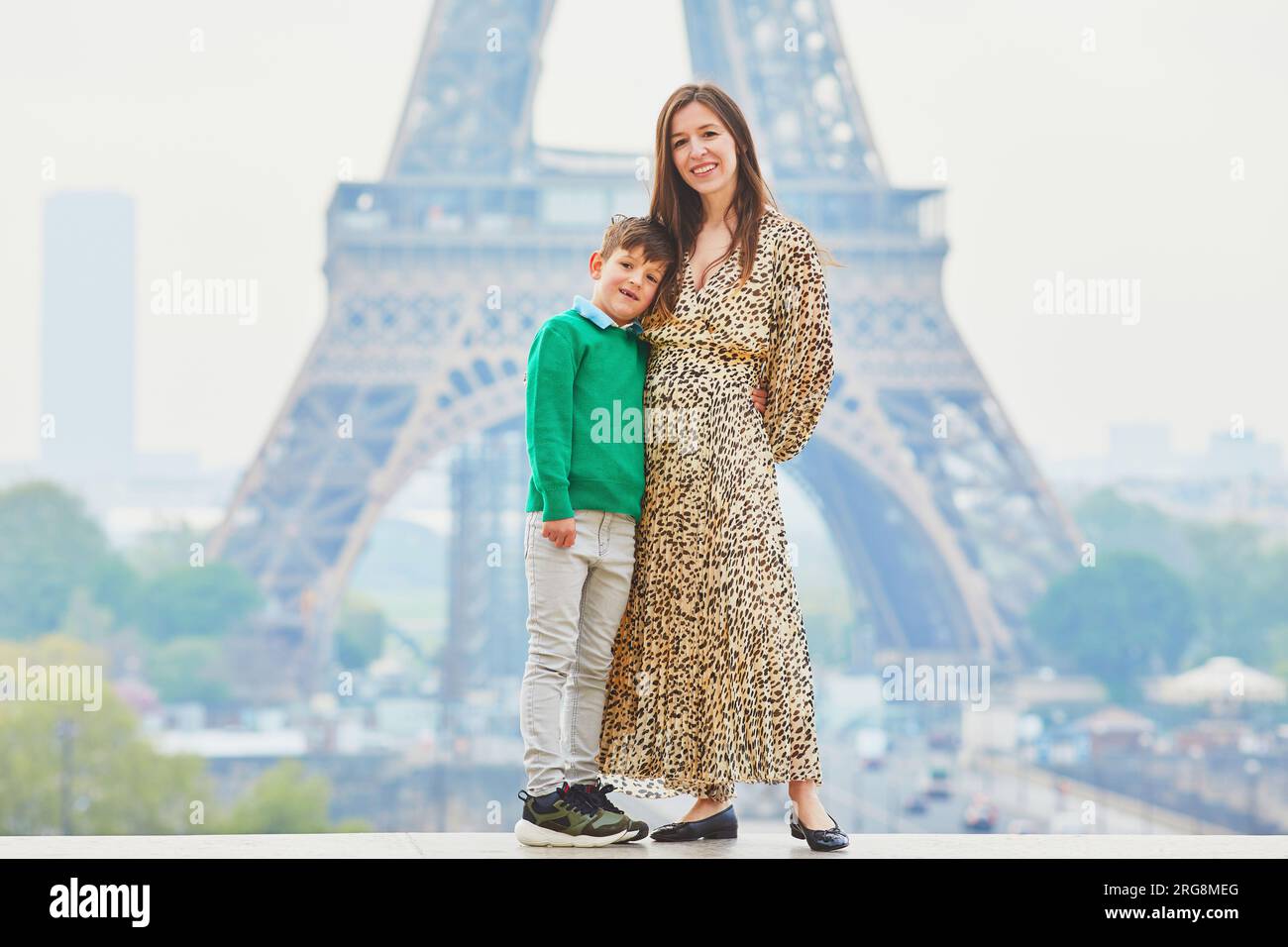 Happy family of two enjoying their trip to Paris, France. Mother and ...