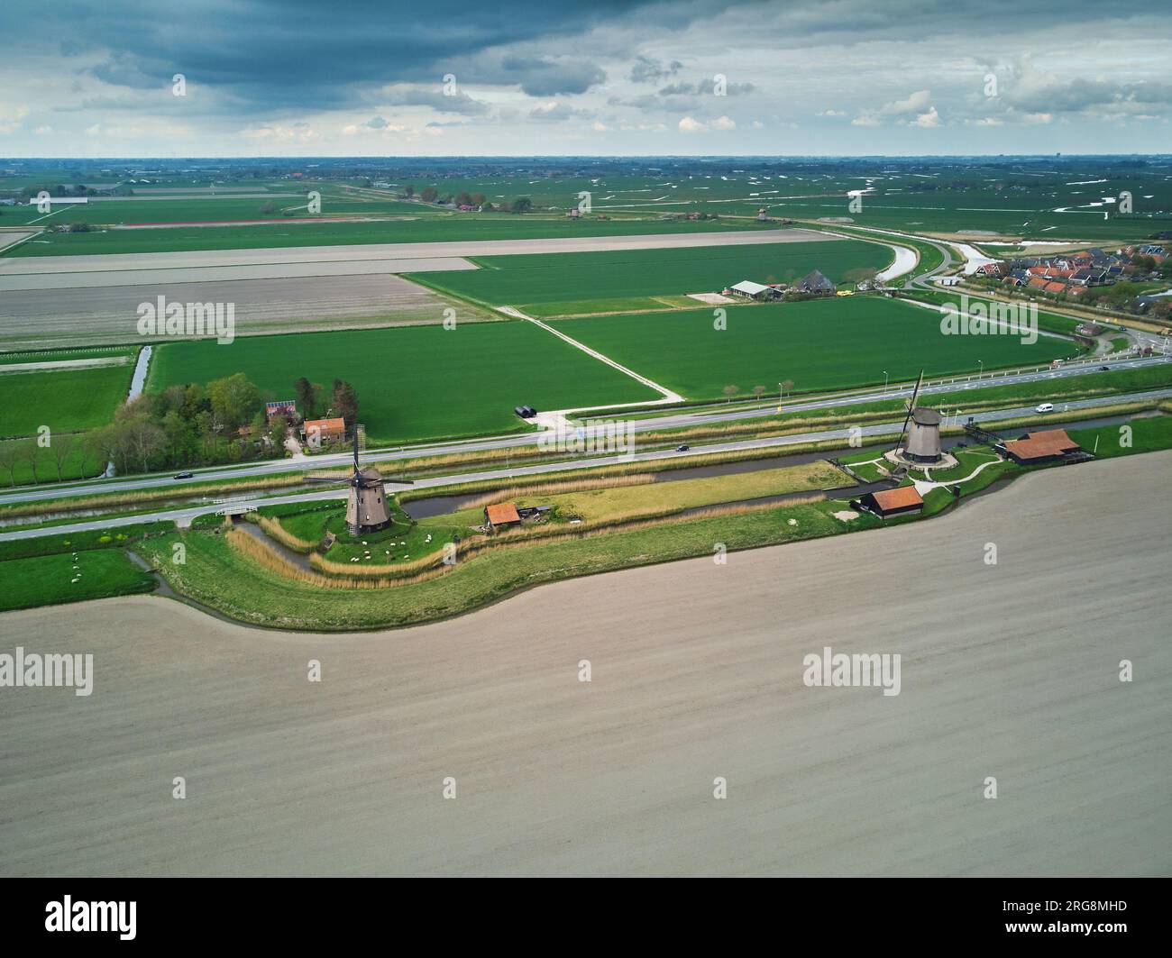 Aerial drone view of traditional Dutch windmill on the field. Typical ...