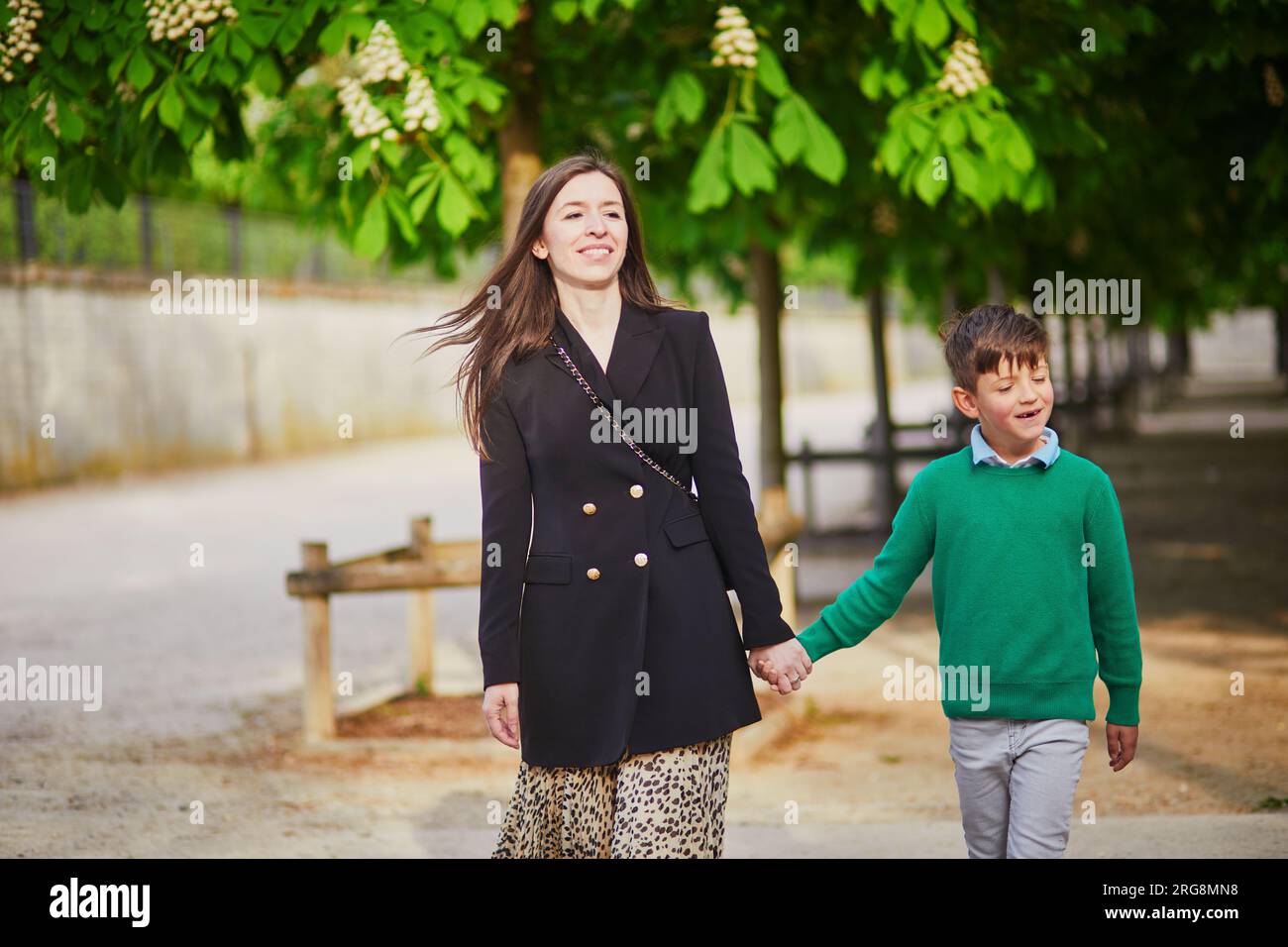 Happy family of two enjoying their trip to Paris, France. Mother and ...