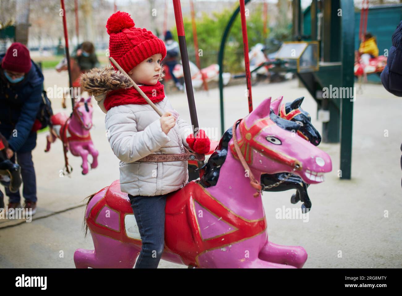 Girl riding on merry go round hi-res stock photography and images - Alamy