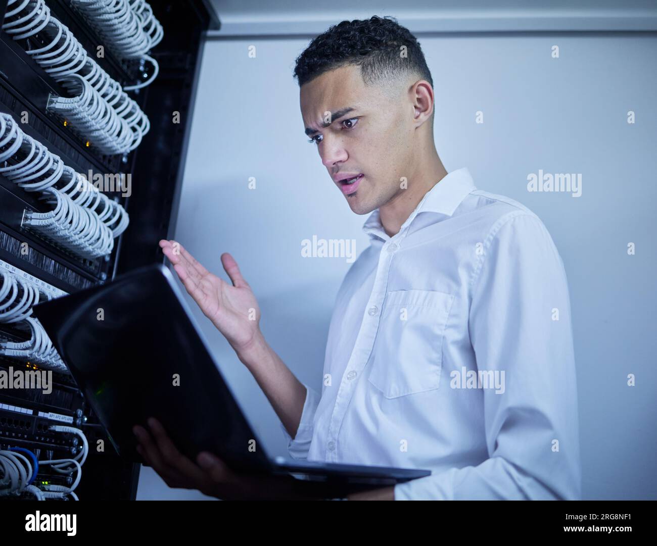 Laptop problem, server room technician and man react to software glitch ...