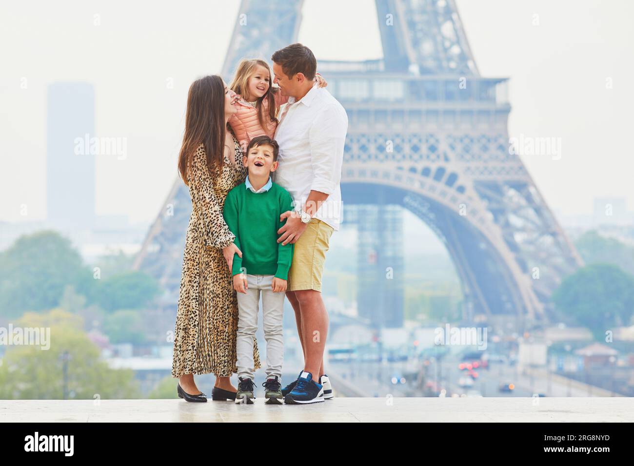 Happy family of four enjoying their trip to Paris, France. Mother ...
