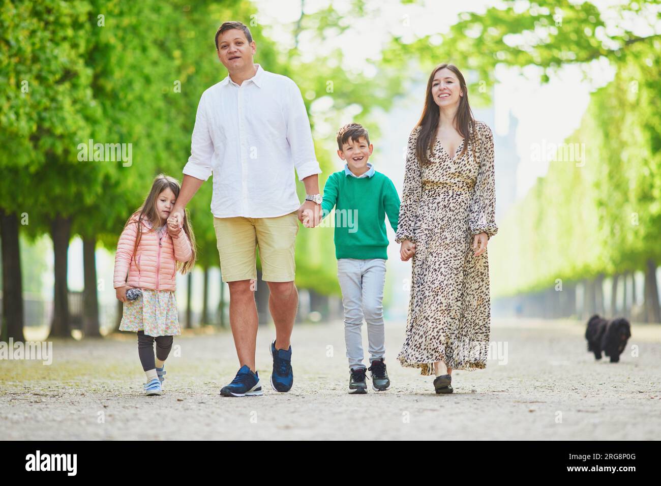 Happy family of four enjoying their trip to Paris, France. Mother ...