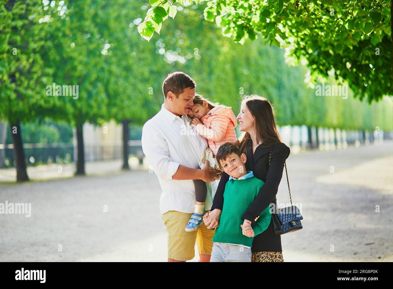 Happy family of four enjoying their trip to Paris, France. Mother ...