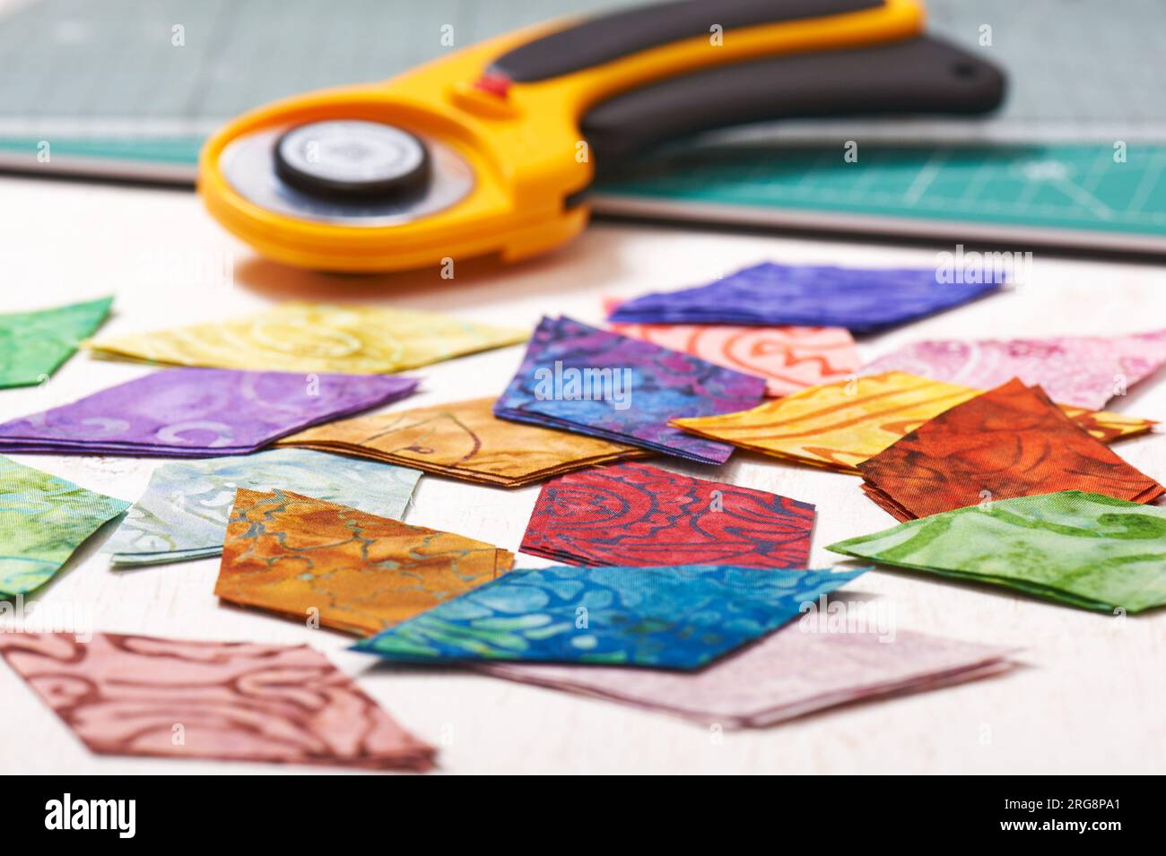 Many sliced pile fabrics of diamond shapes, folded randomly one by one ...