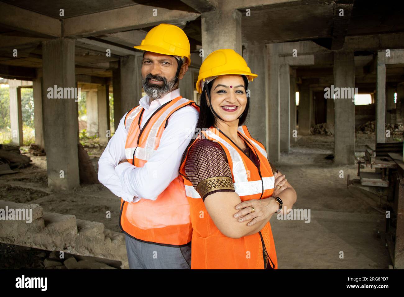 Portrait of two Indian male and female civil engineers or architect ...