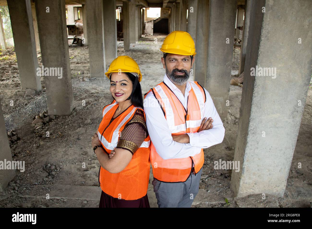 Portrait of two Indian male and female civil engineers or architect ...