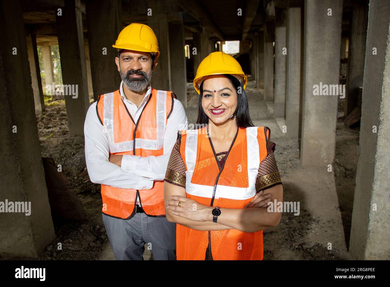Portrait of two Indian male and female civil engineers or architect ...
