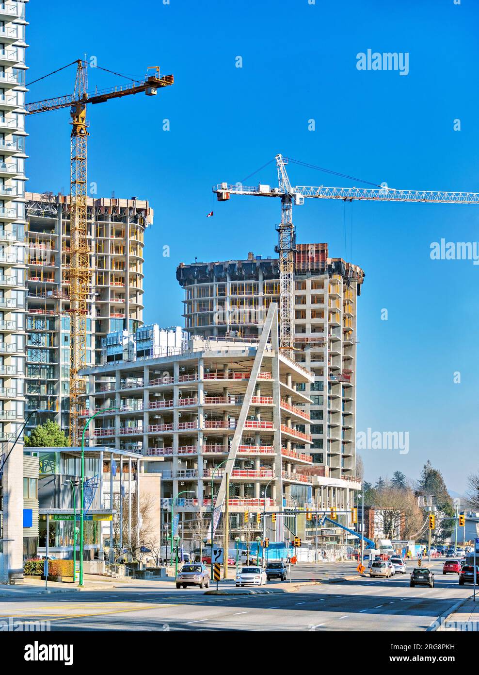 High-rise buildings under construction on bright sunny day Stock Photo ...