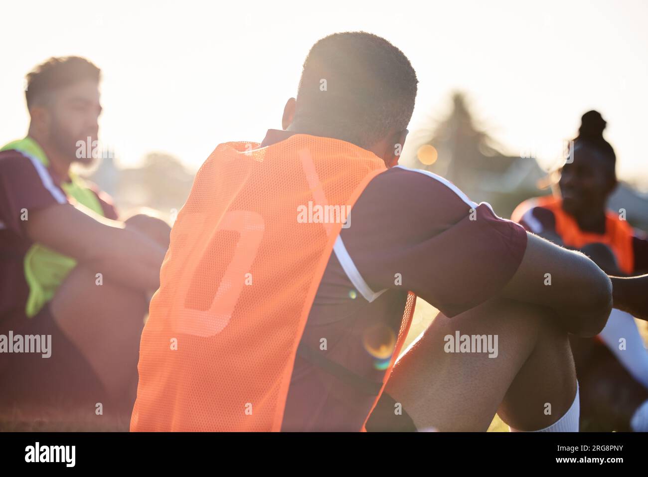 Group, rugby and men relax on field outdoor, talking and communication ...