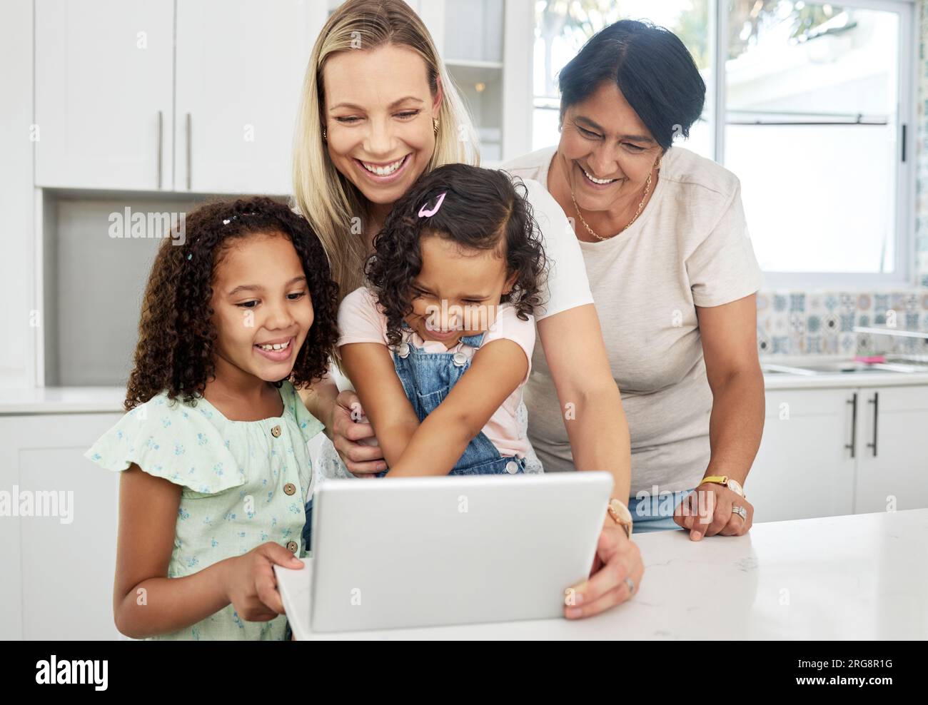 Blended family, adoption and a girl with her mother on a tablet in the ...