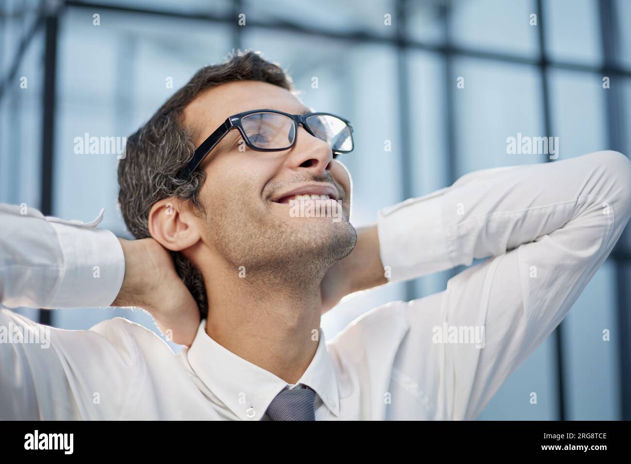 relaxed Caucasian young male rest in chair distracted from computer ...