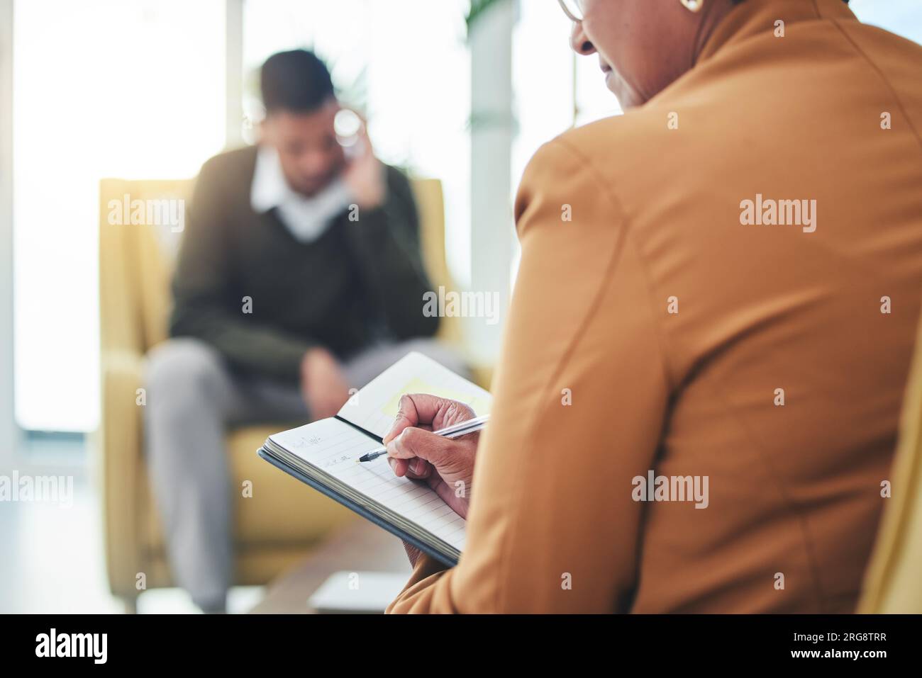 Psychologist writing, man stress and sofa with woman, therapy and ...