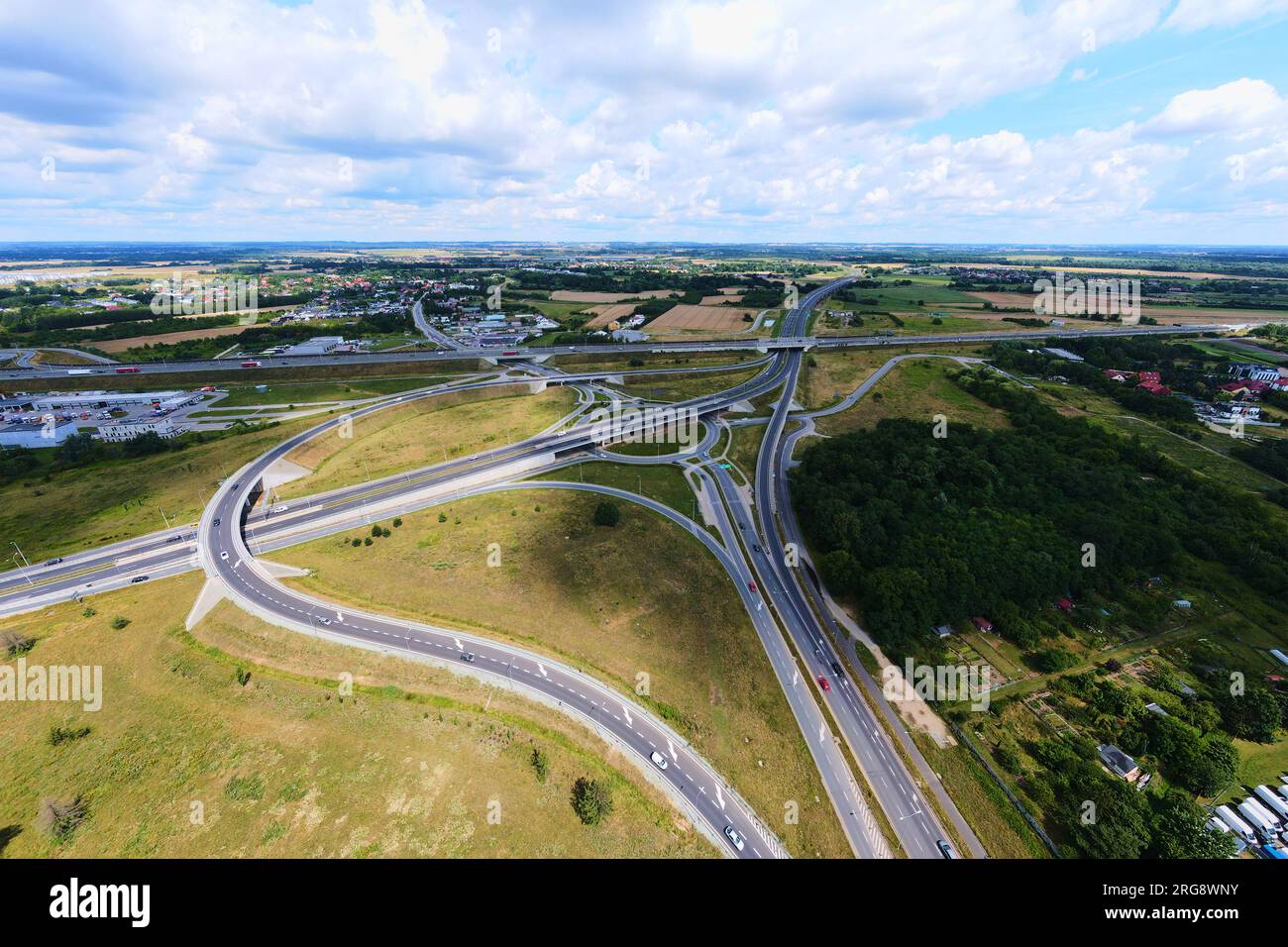 Aerial view of roundabout intersection with driving cars. Car traffic ...