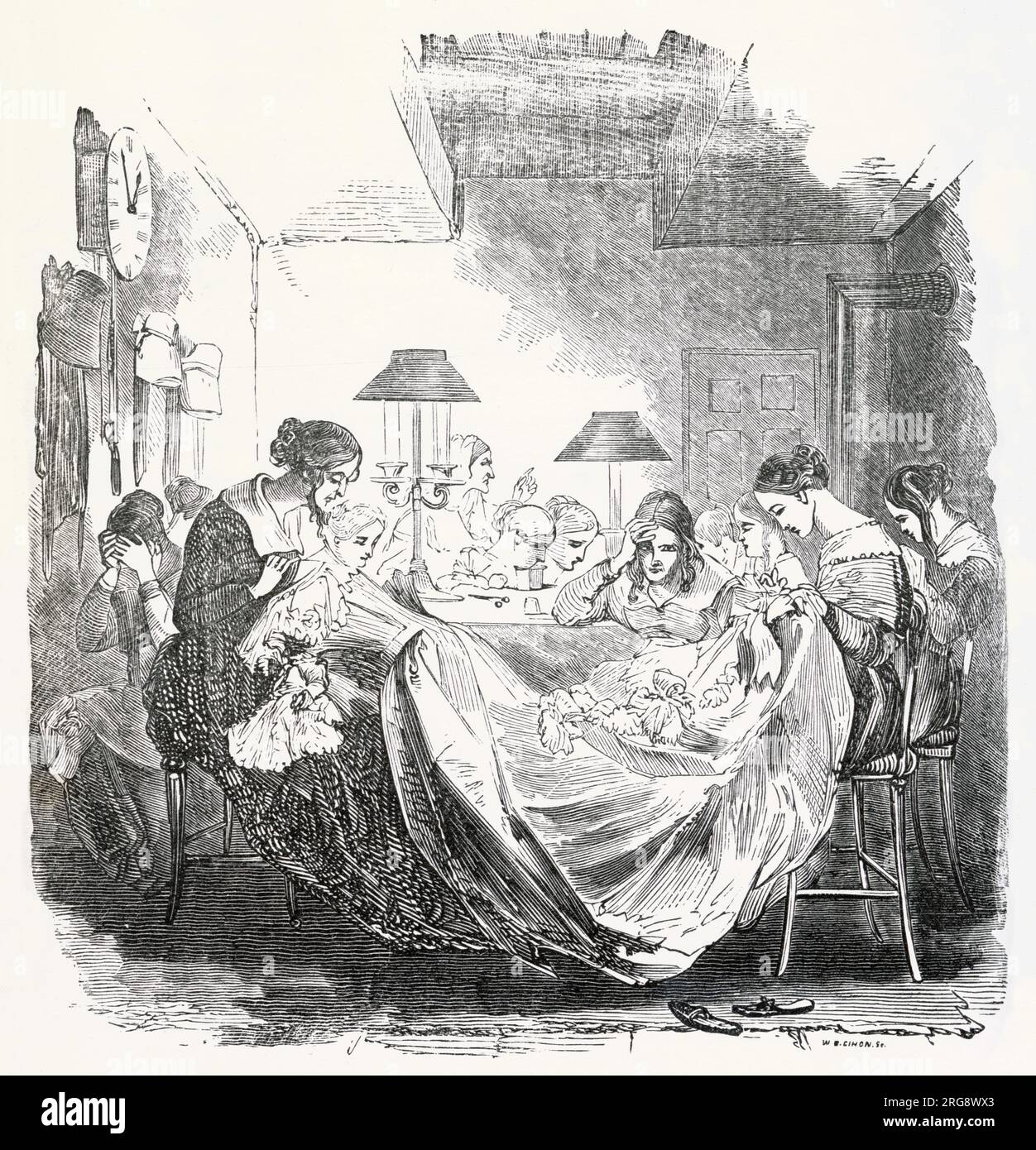 A group of female dressmakers working together on an elaborate evening ...
