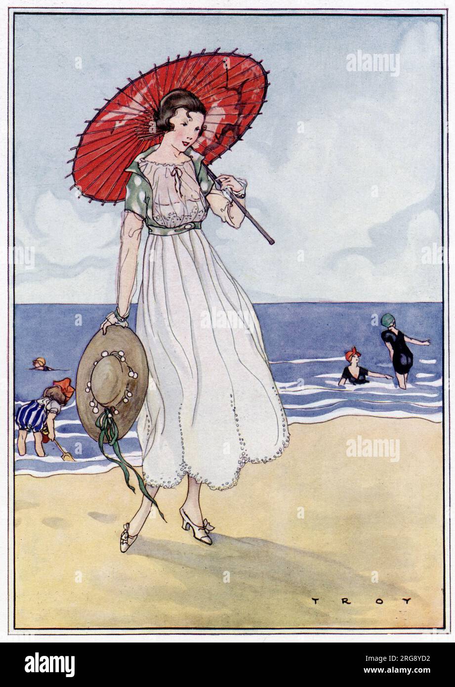 A young lady shades her complexion from the harsh rays of the sun ...