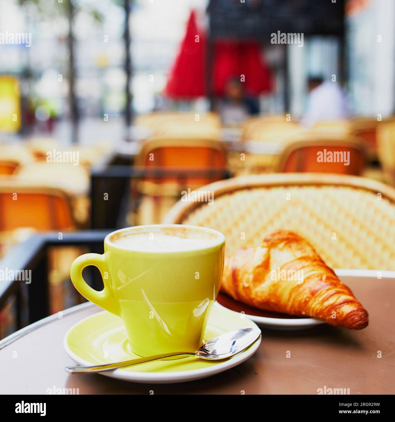 Cup of fresh hot coffee and traditional French croissant on table of ...