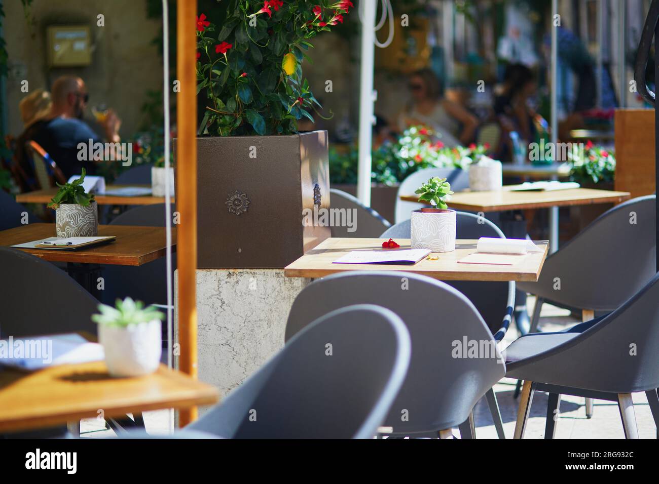 Table of traditional Parisian outdoor cafe. Empty restaurant waiting ...