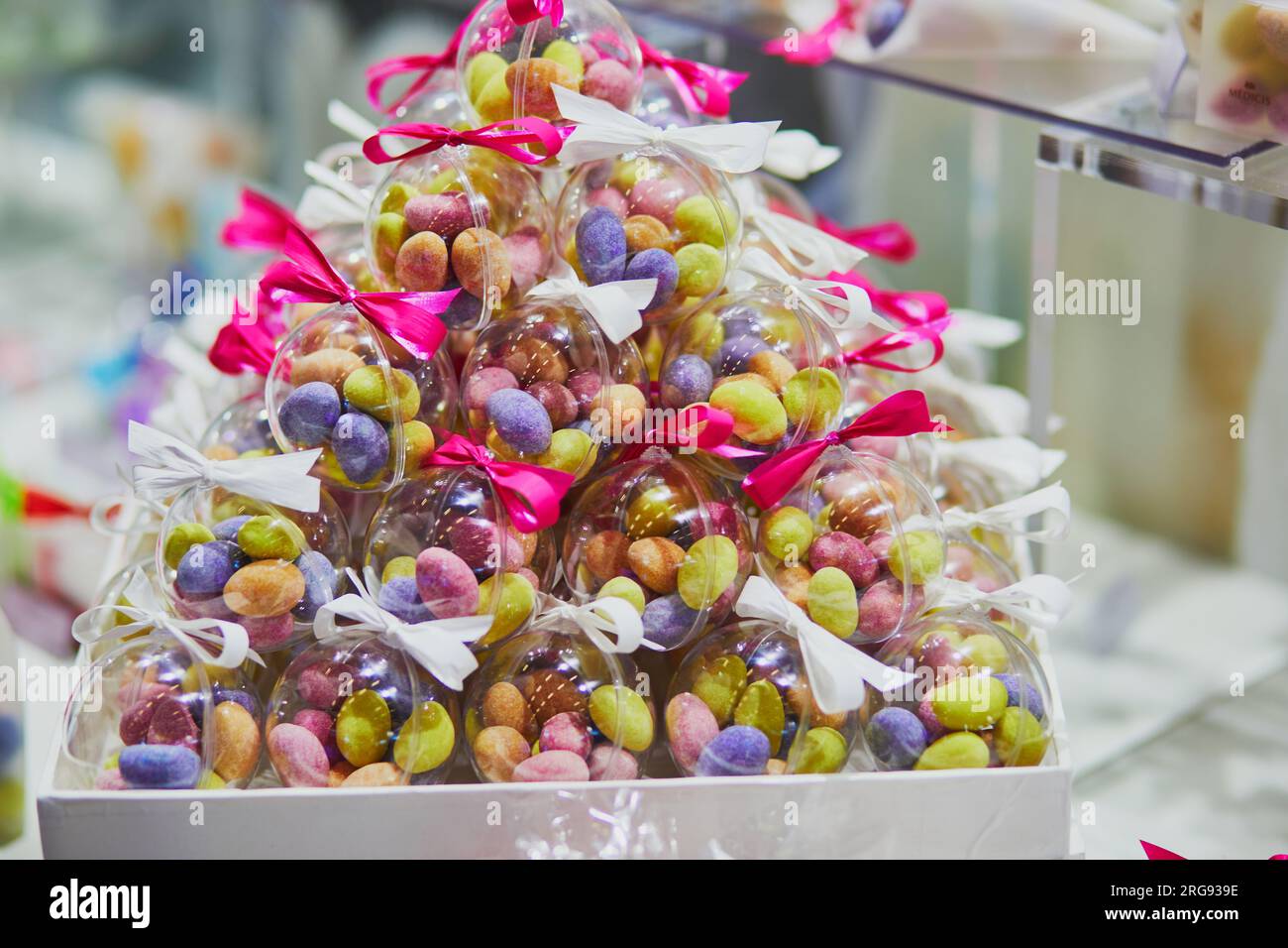 Colorful candies in transparent bags at wedding reception or event ...