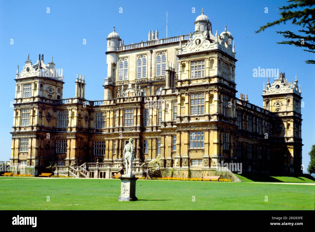View of Wollaton Hall, near Lenton, Nottingham, with a statue in the ...