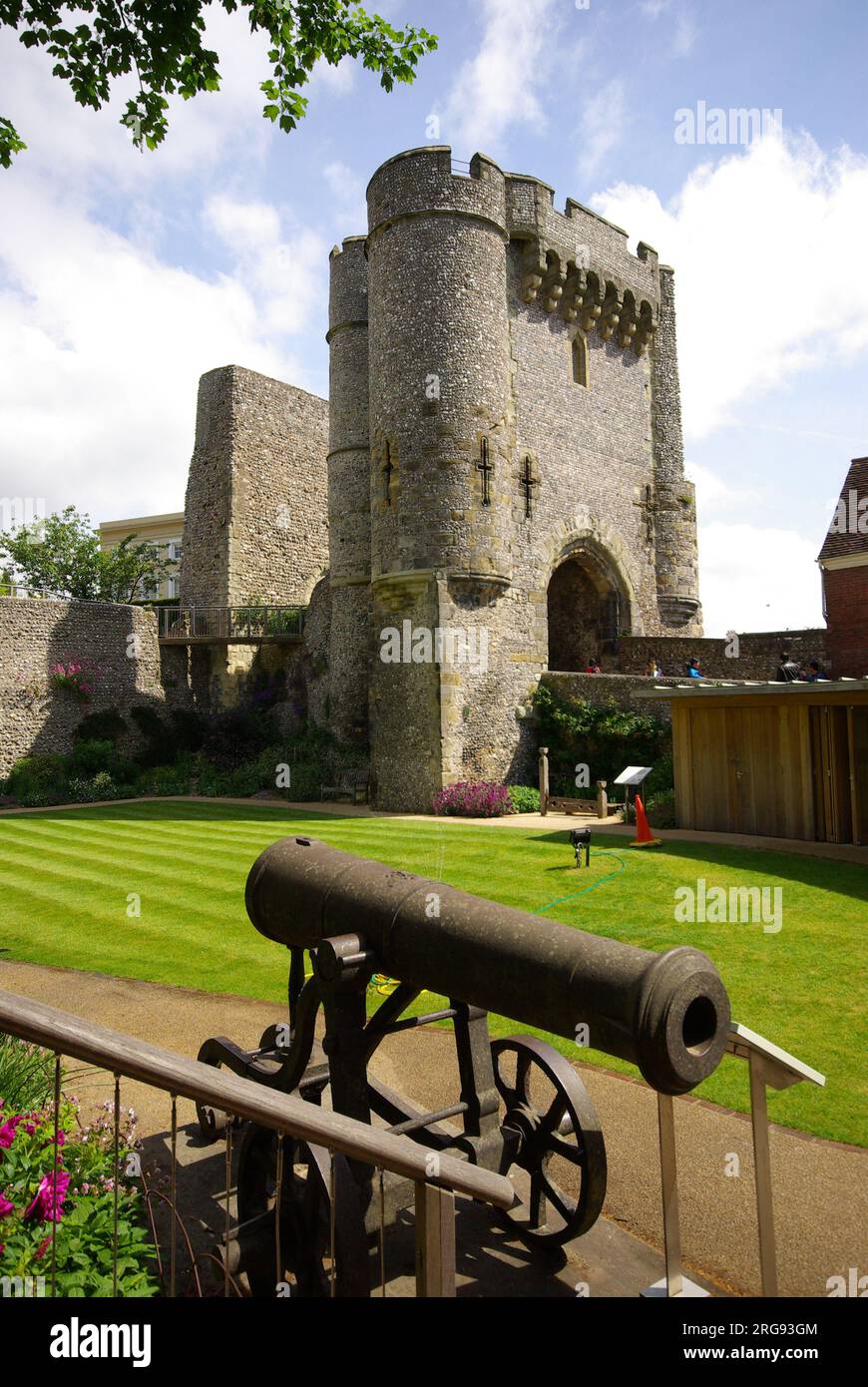 View of Lewes Castle barbican, East Sussex, with a cannon on display in ...
