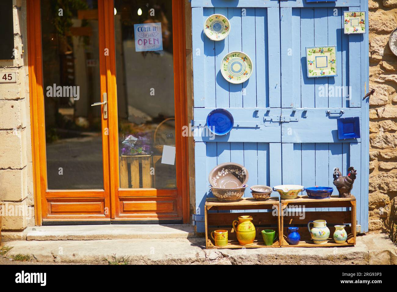 Souvenir shop selling clay dishes and crockery in medieval village of ...