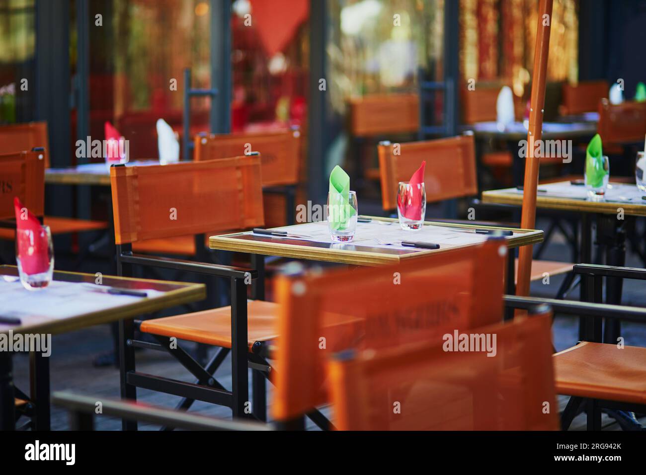 Table of traditional Parisian outdoor cafe. Empty restaurant waiting ...