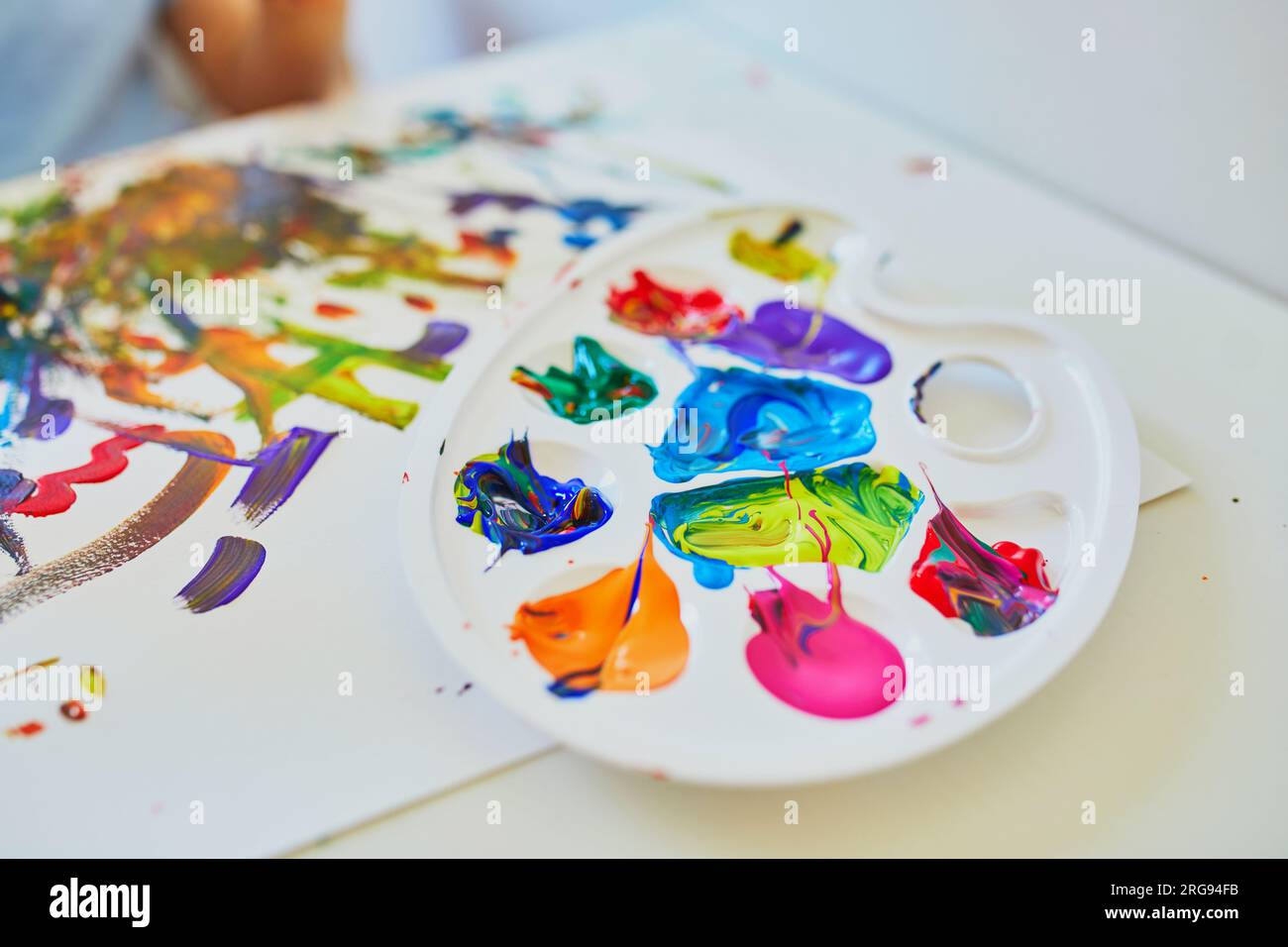 Closeup of palette with colorful acrylic paints. Creative games ...