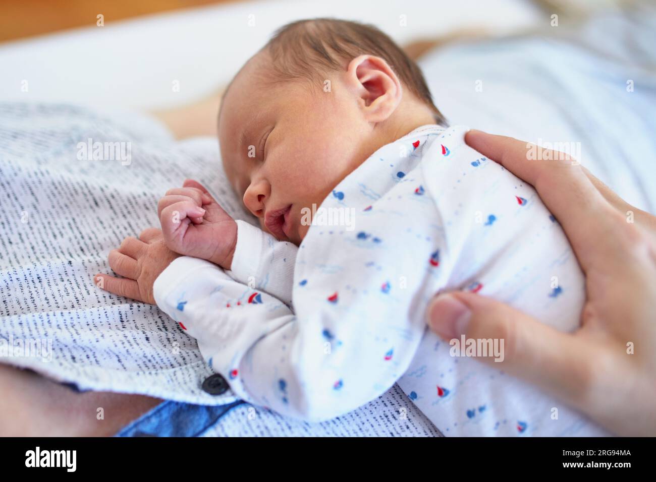 Human newborn sleeping on parent hi-res stock photography and images ...