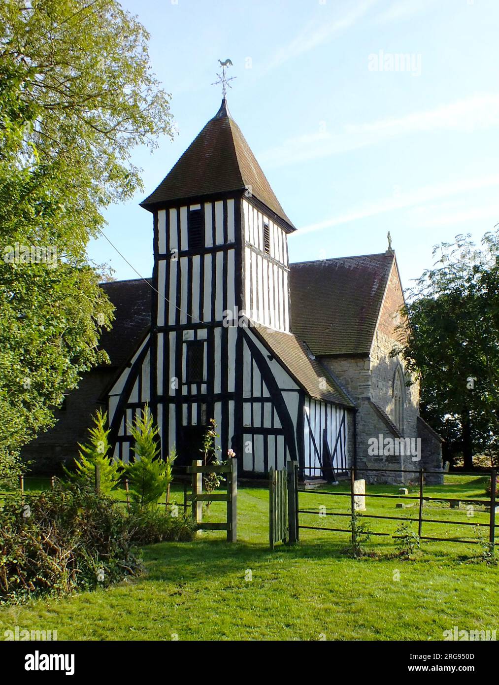 St Peter's Church, with an unusual black and white tower, in the ...