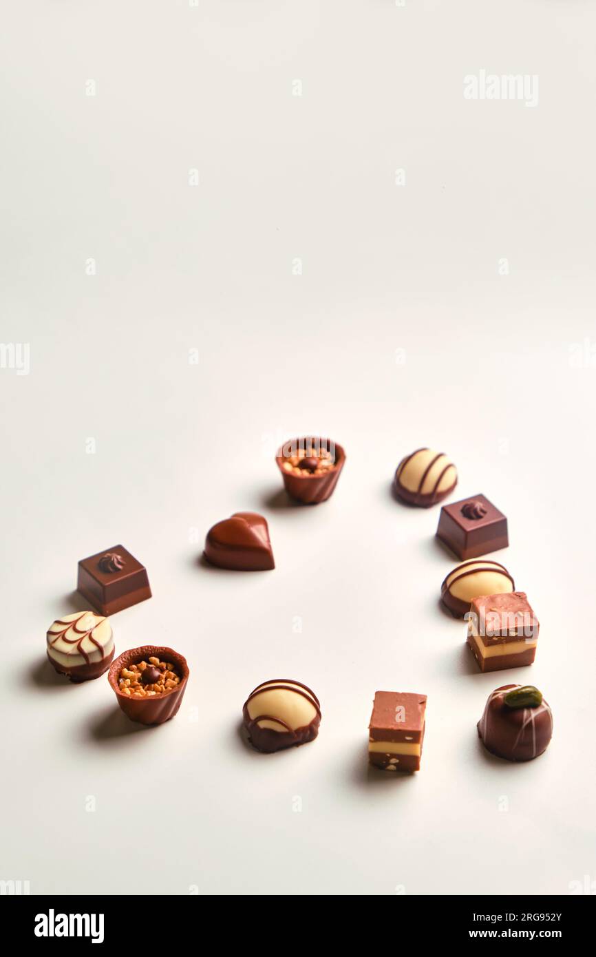 Heart shape made with various types of chocolate truffles Stock Photo ...