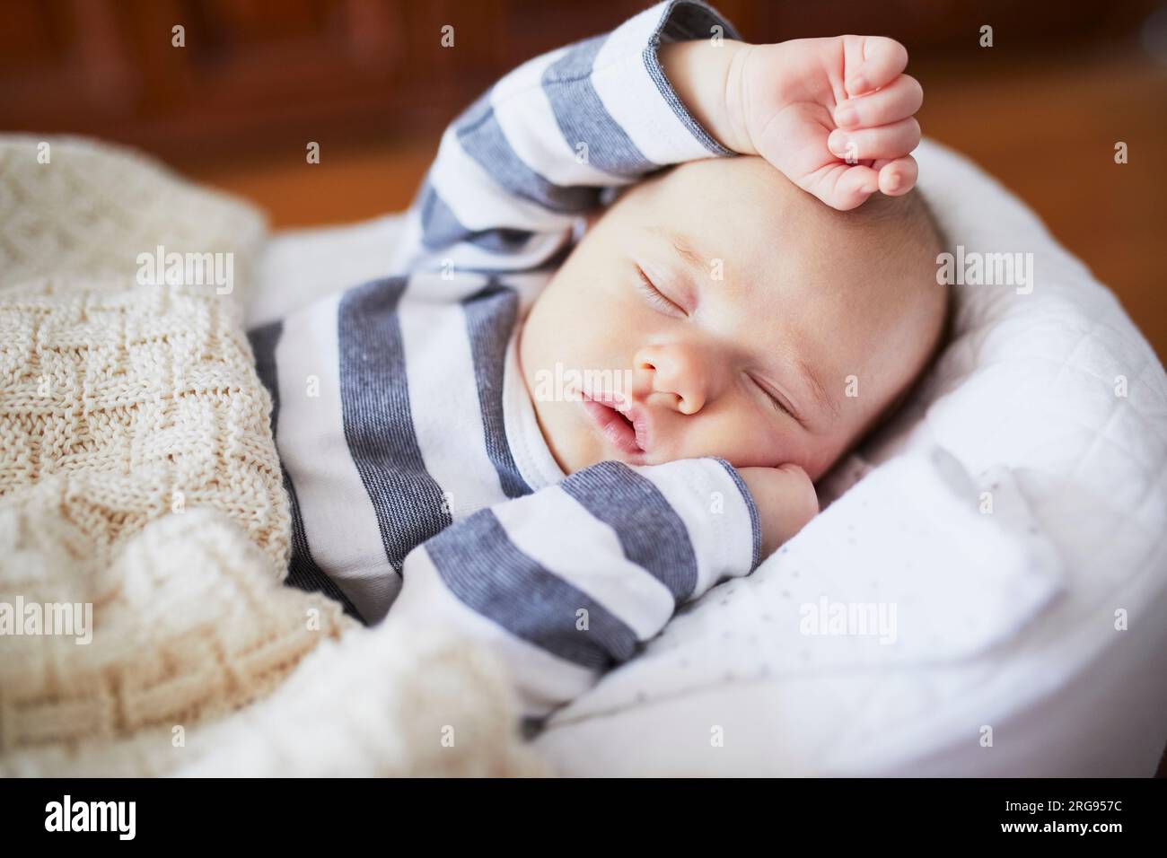 Adorable baby girl sleeping in the crib. Little child having a day nap ...