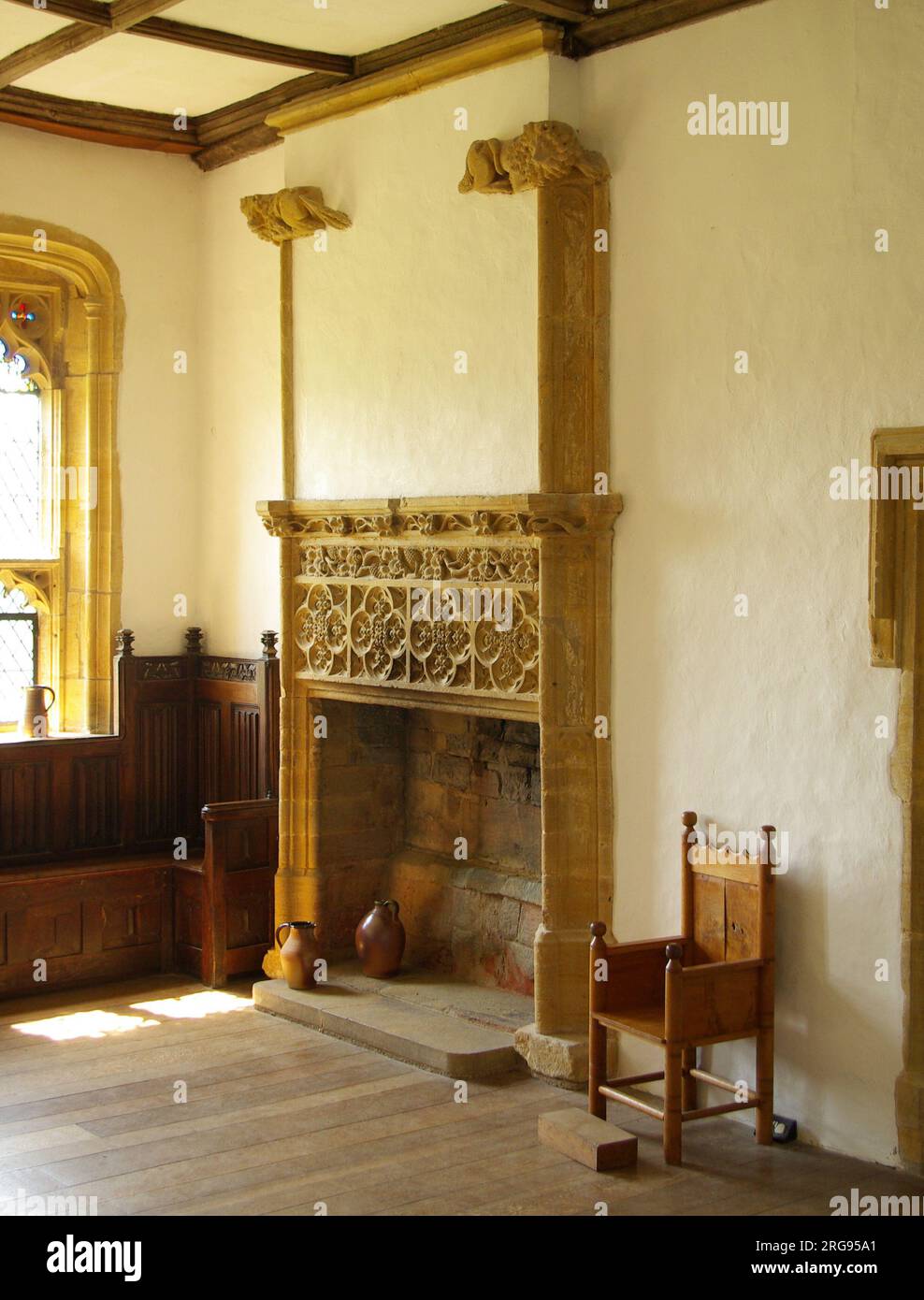 Carved fireplace in Muchelney Abbey, a Grade I listed building in the ...