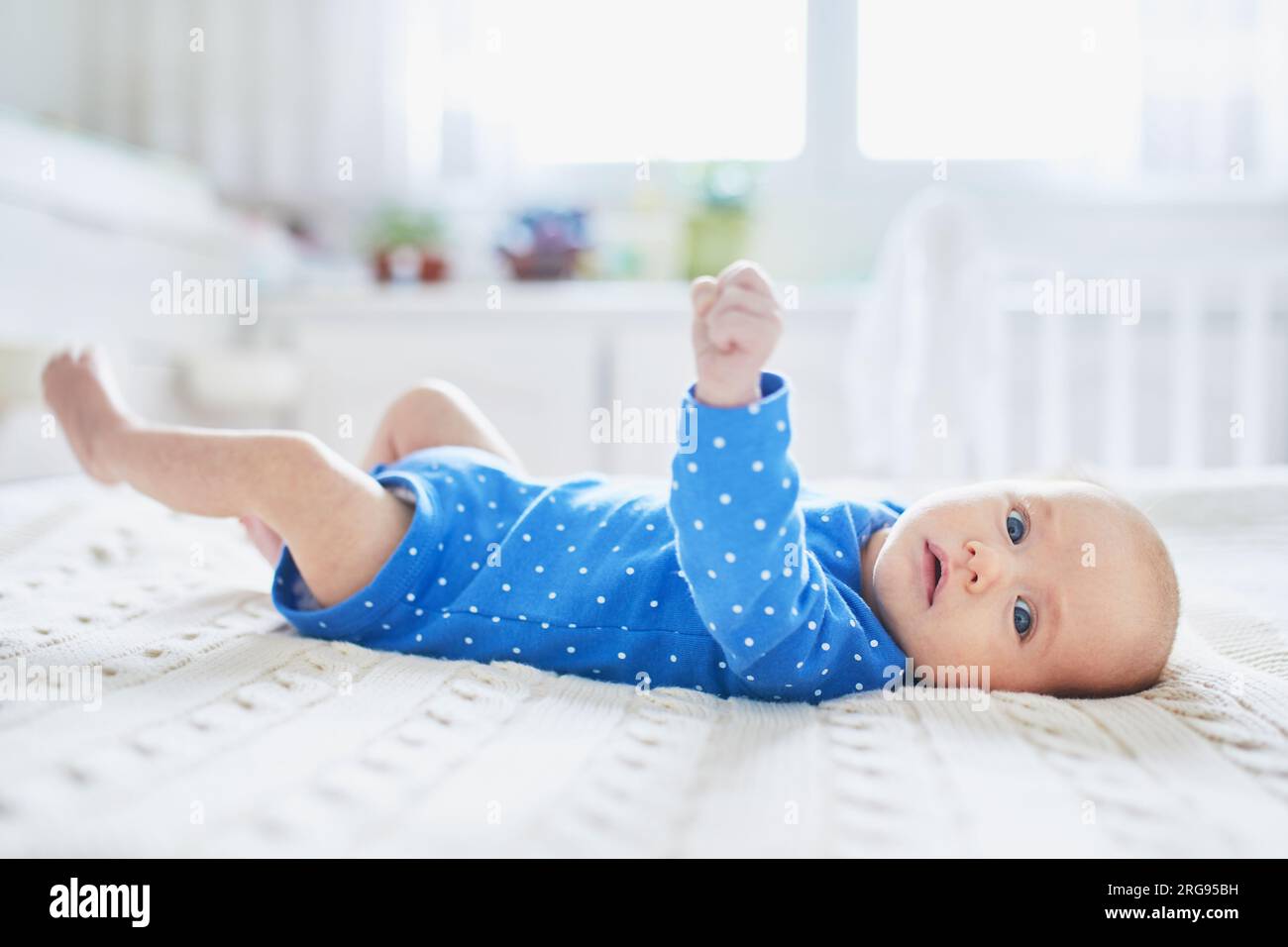 Baby wearing blue clothes hi-res stock photography and images - Alamy