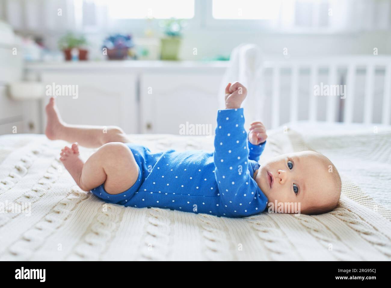 Baby wearing blue clothes hi-res stock photography and images - Alamy