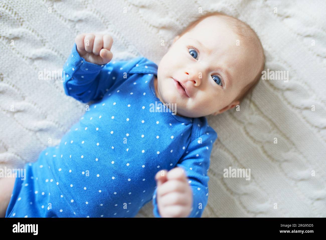Baby wearing blue clothes hi-res stock photography and images - Alamy