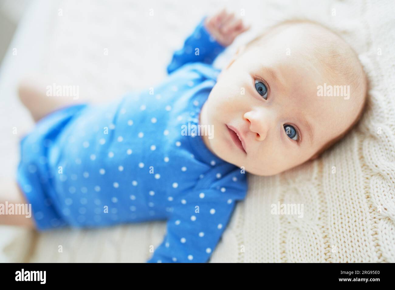 Baby wearing blue clothes hi-res stock photography and images - Alamy