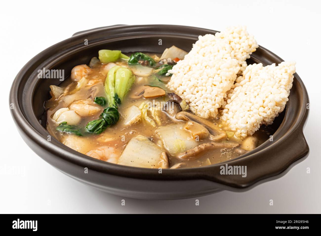 Fried glutinous rice soup with seafood on white background Stock Photo ...