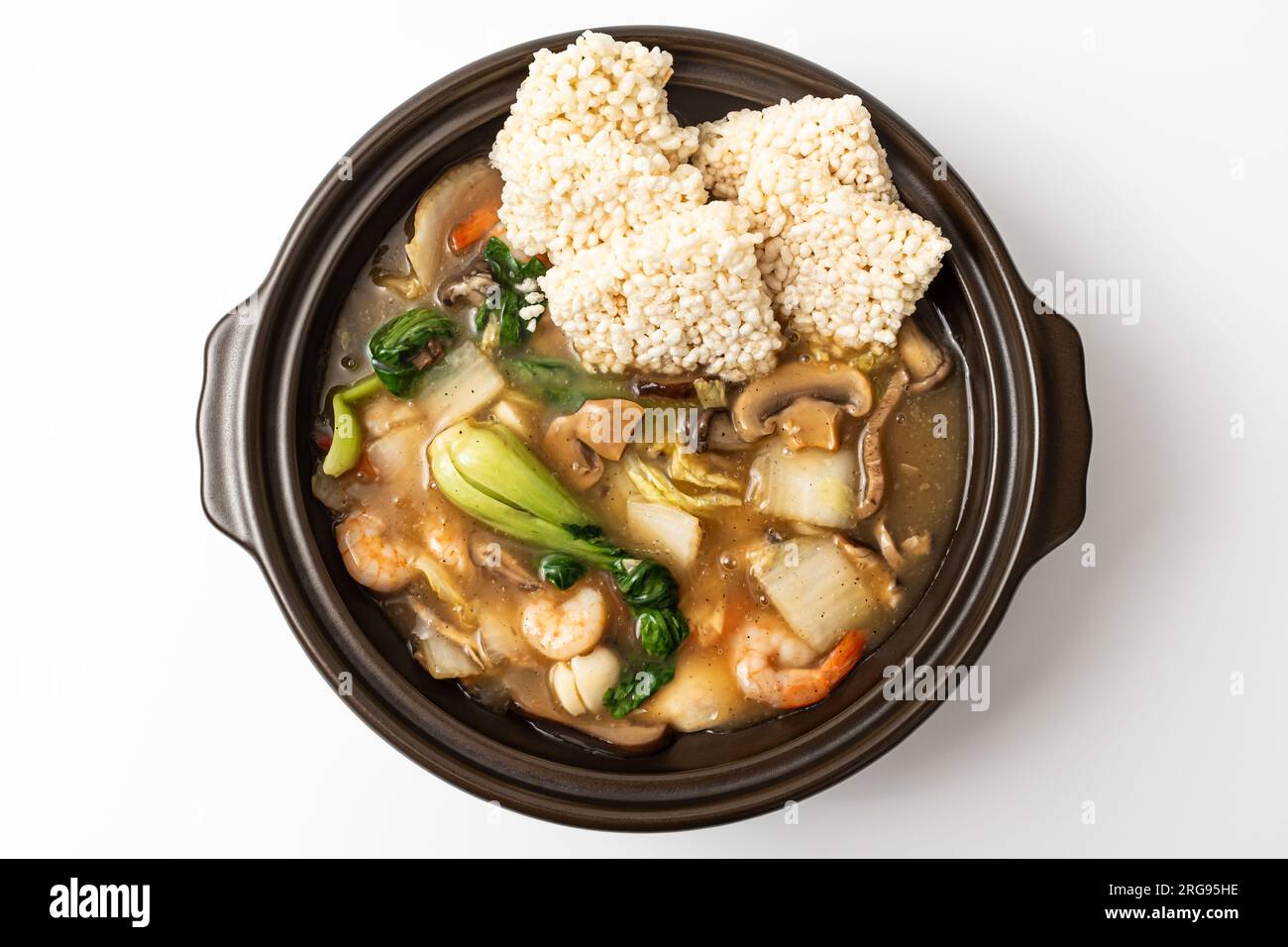 Fried glutinous rice soup with seafood on white background Stock Photo ...
