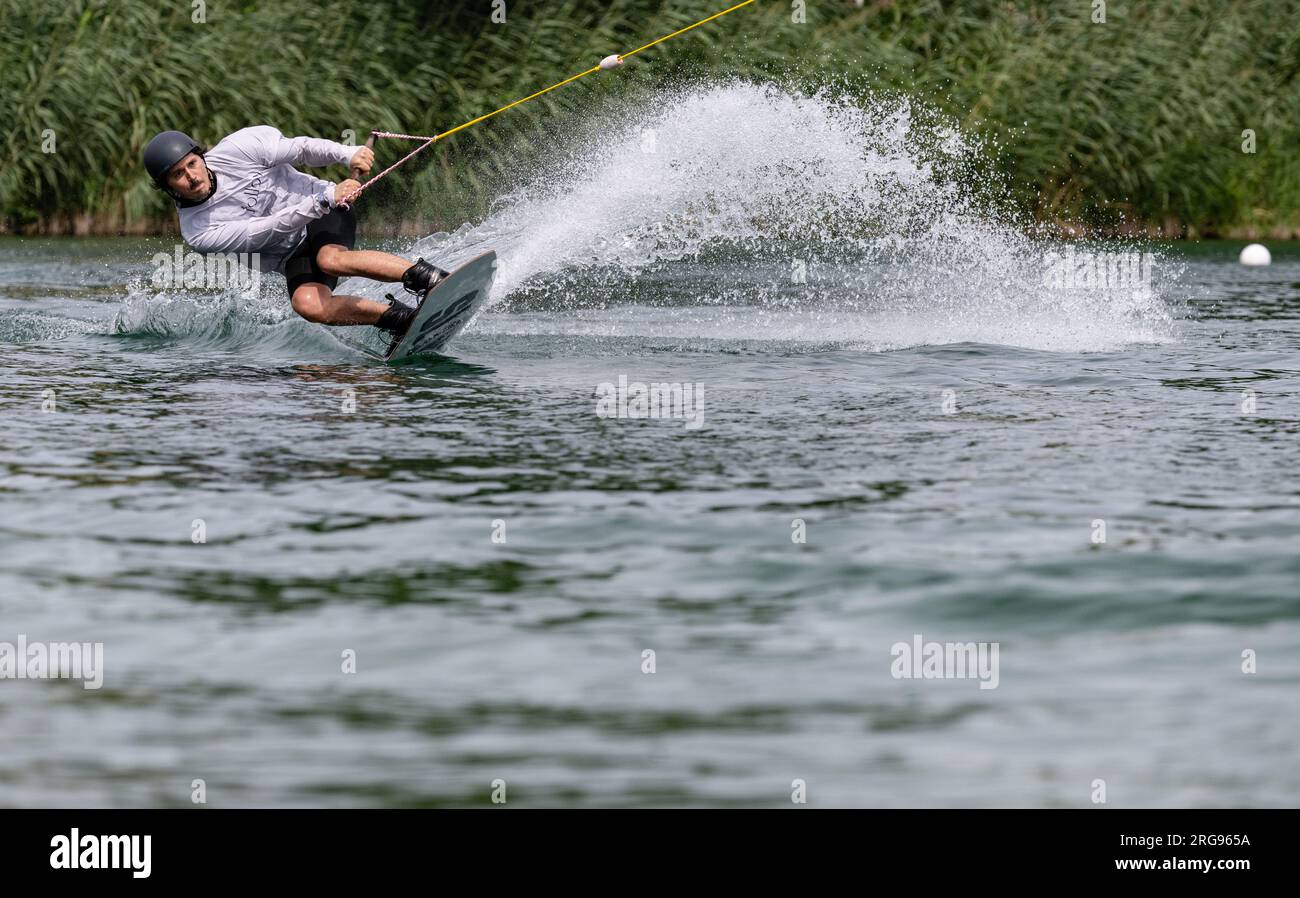 St. Leon Rot, Germany. 08th Aug, 2023. A wakeboarder rides on the water ...