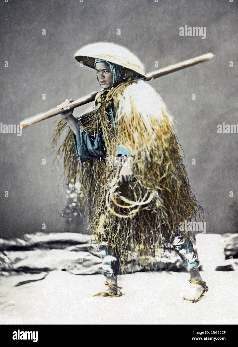 Farmer in grass coat and snow scene, Japan, circa 1880s' Stock Photo ...