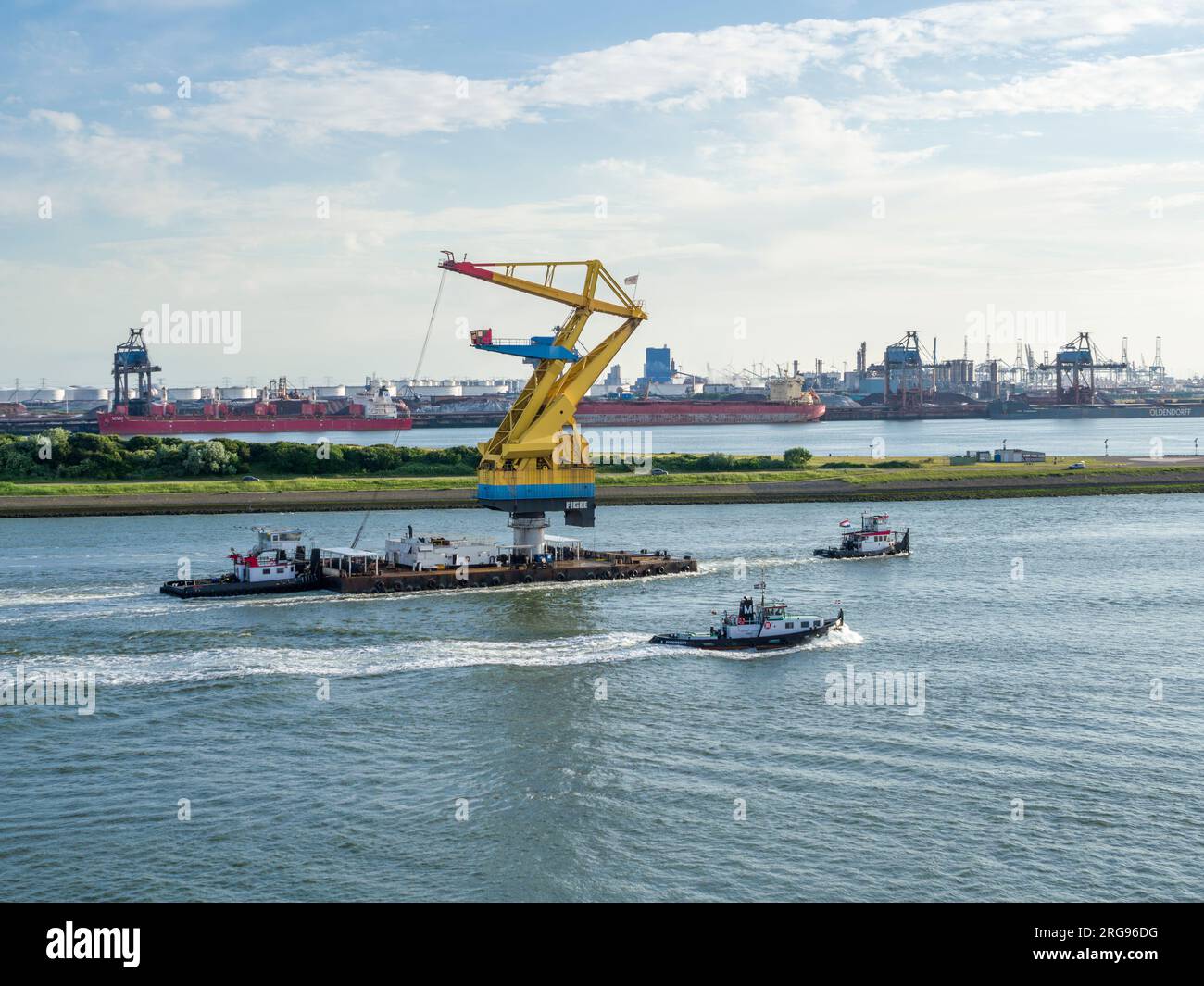 Tugboats towing a Figee crane barge in the Port of Rotterdam, Rotterdam ...