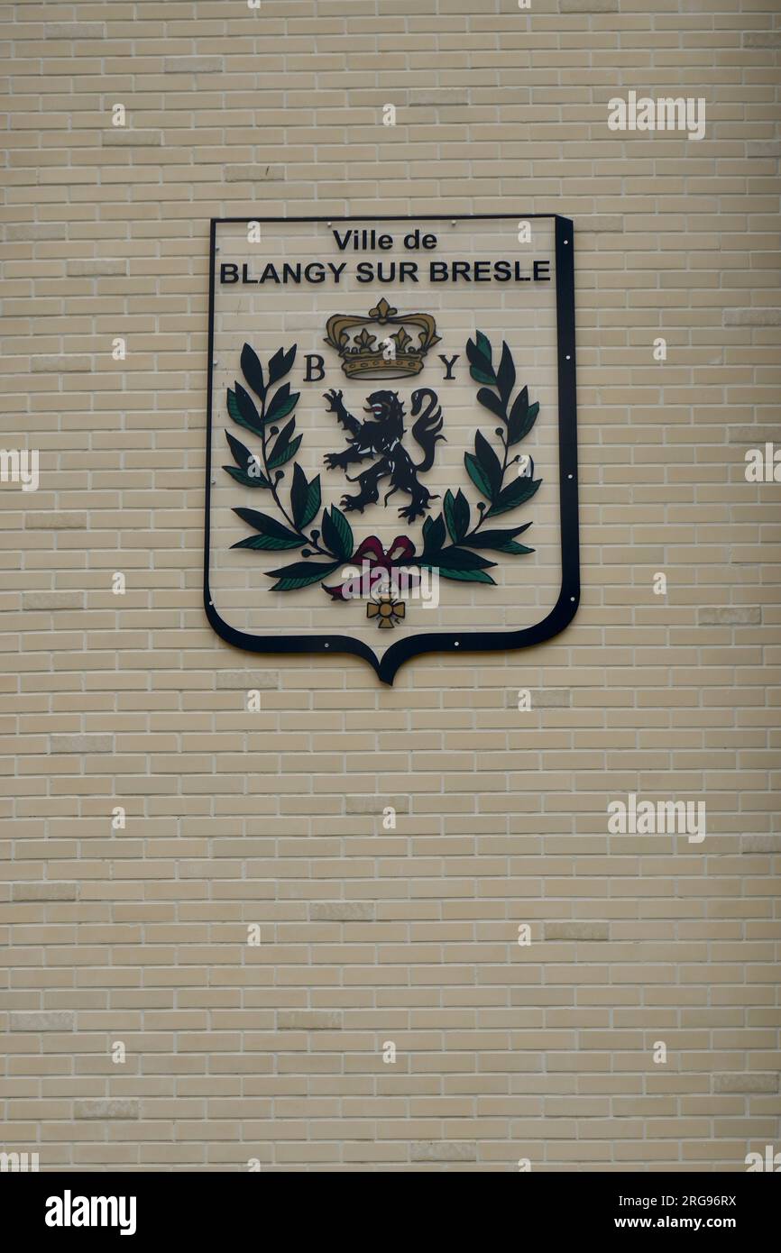 Town Crest on a brick background on The Ville De Blangy Sur Bresle ...