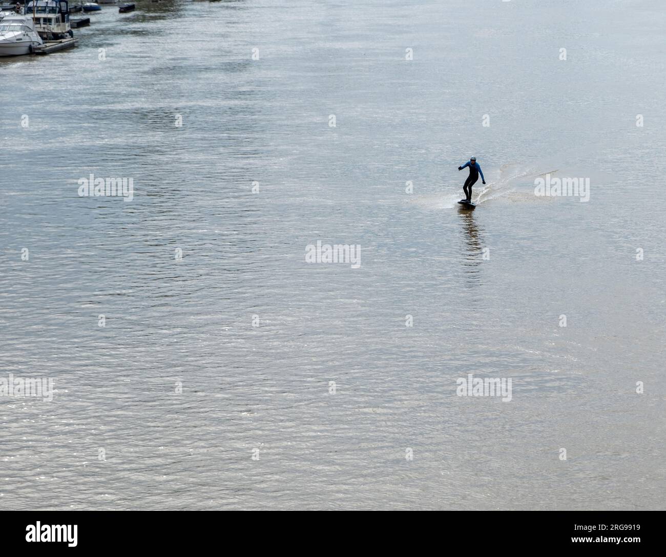 person paddleboarding on a river Stock Photo - Alamy