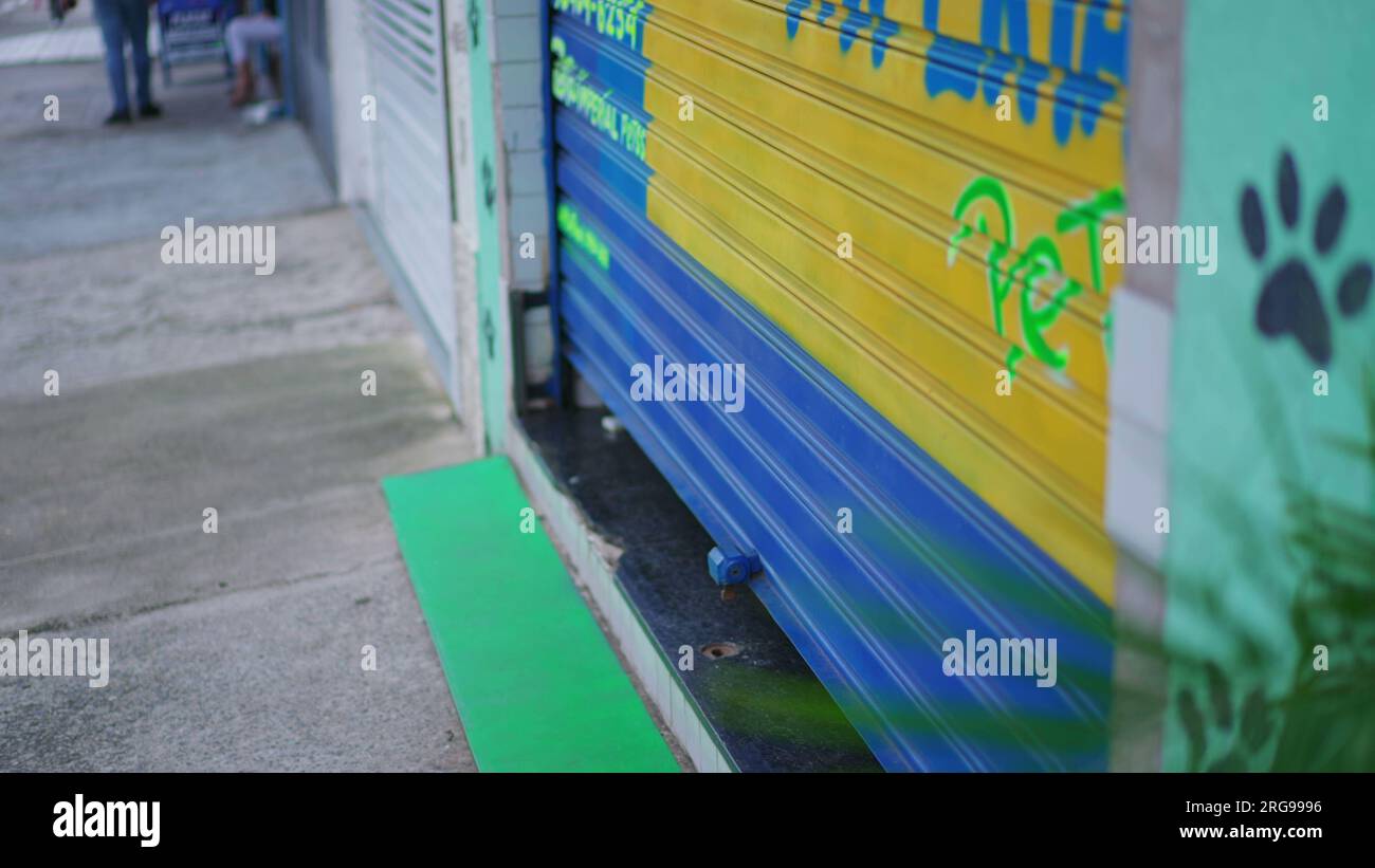 Man closing storefront garage in hi-res stock photography and images ...