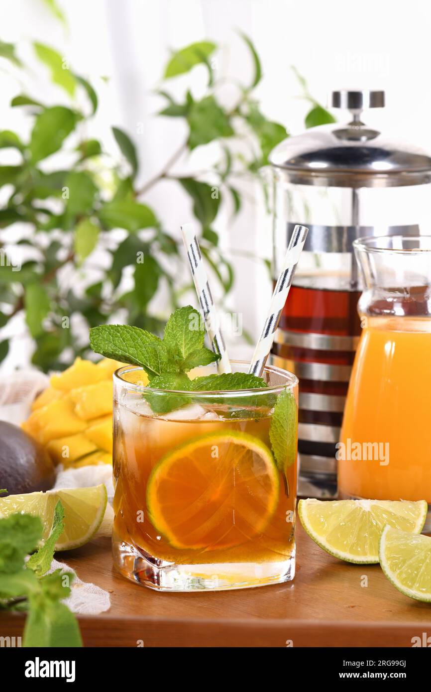 Mango iced tea with lime and mint has the perfect ratio of juice, tea ...